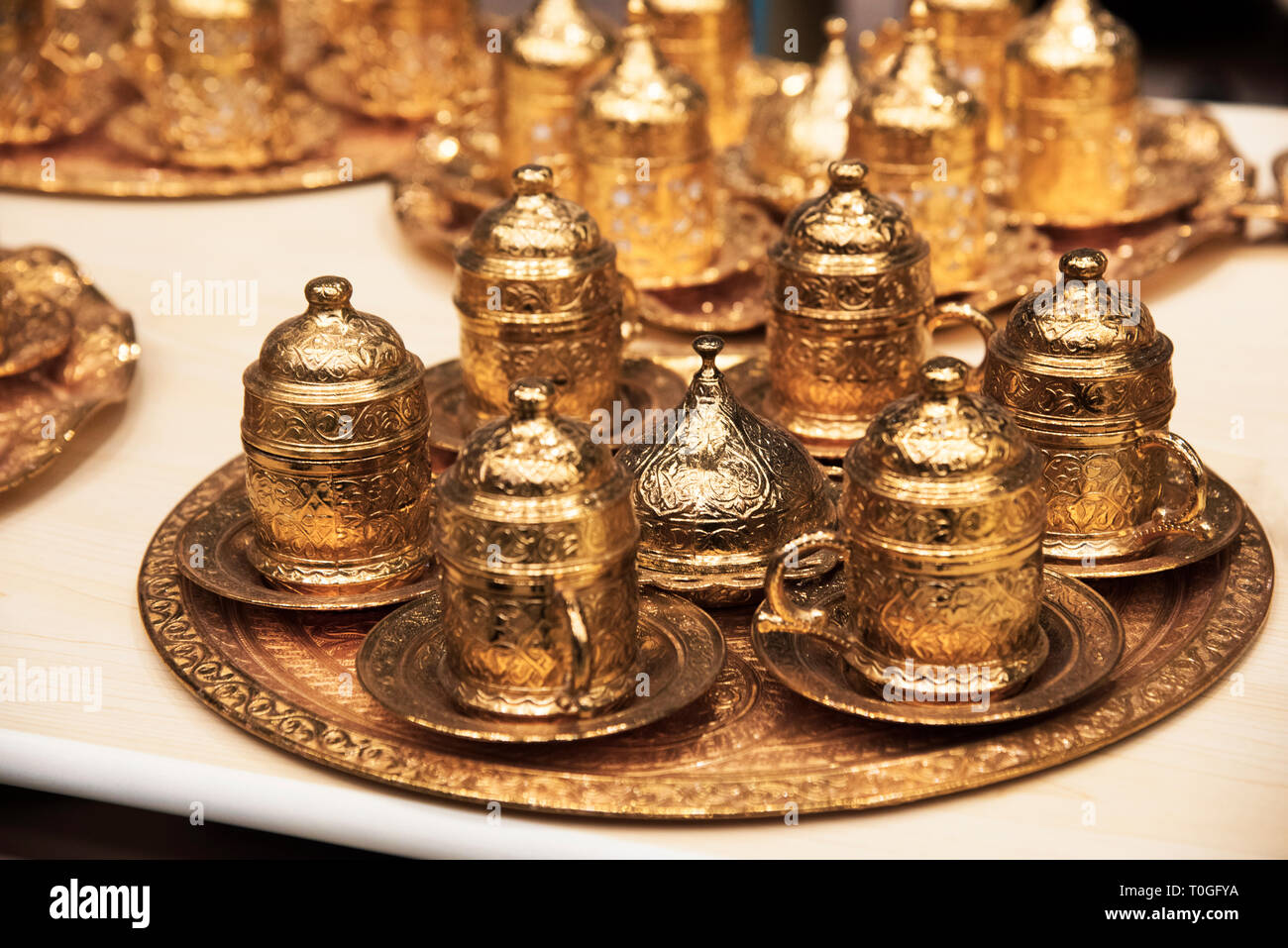 Golden colour set of 6 Cups displayed at a shop, Dubai, UAE Stock Photo ...