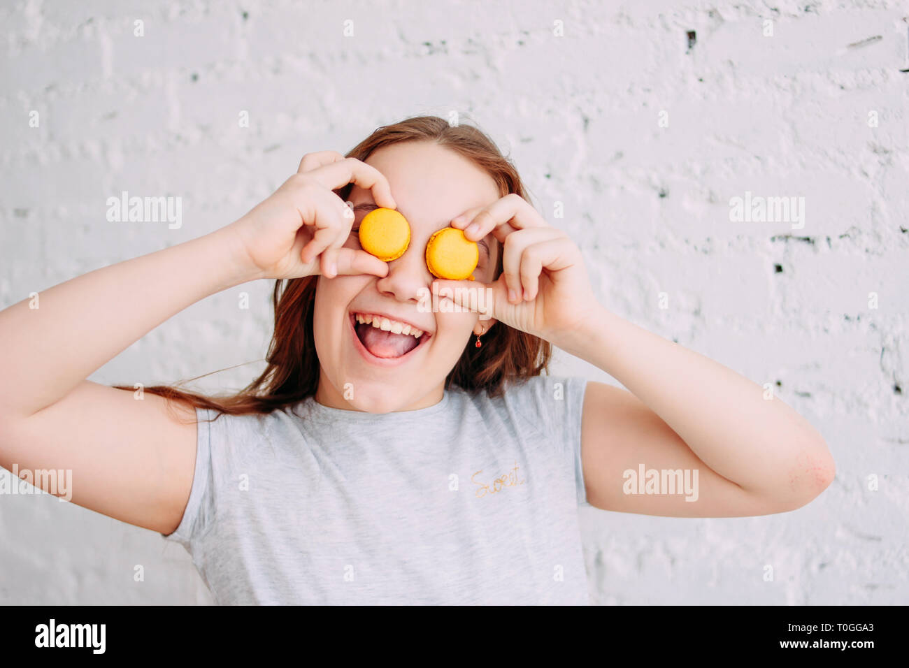 Beautiful charming redhead smiling happy teenager girl closing her eyes ...