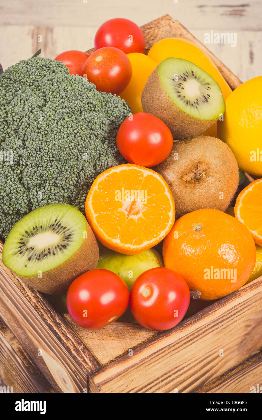 Fresh ripe natural fruits with vegetables in rustic box as food ...