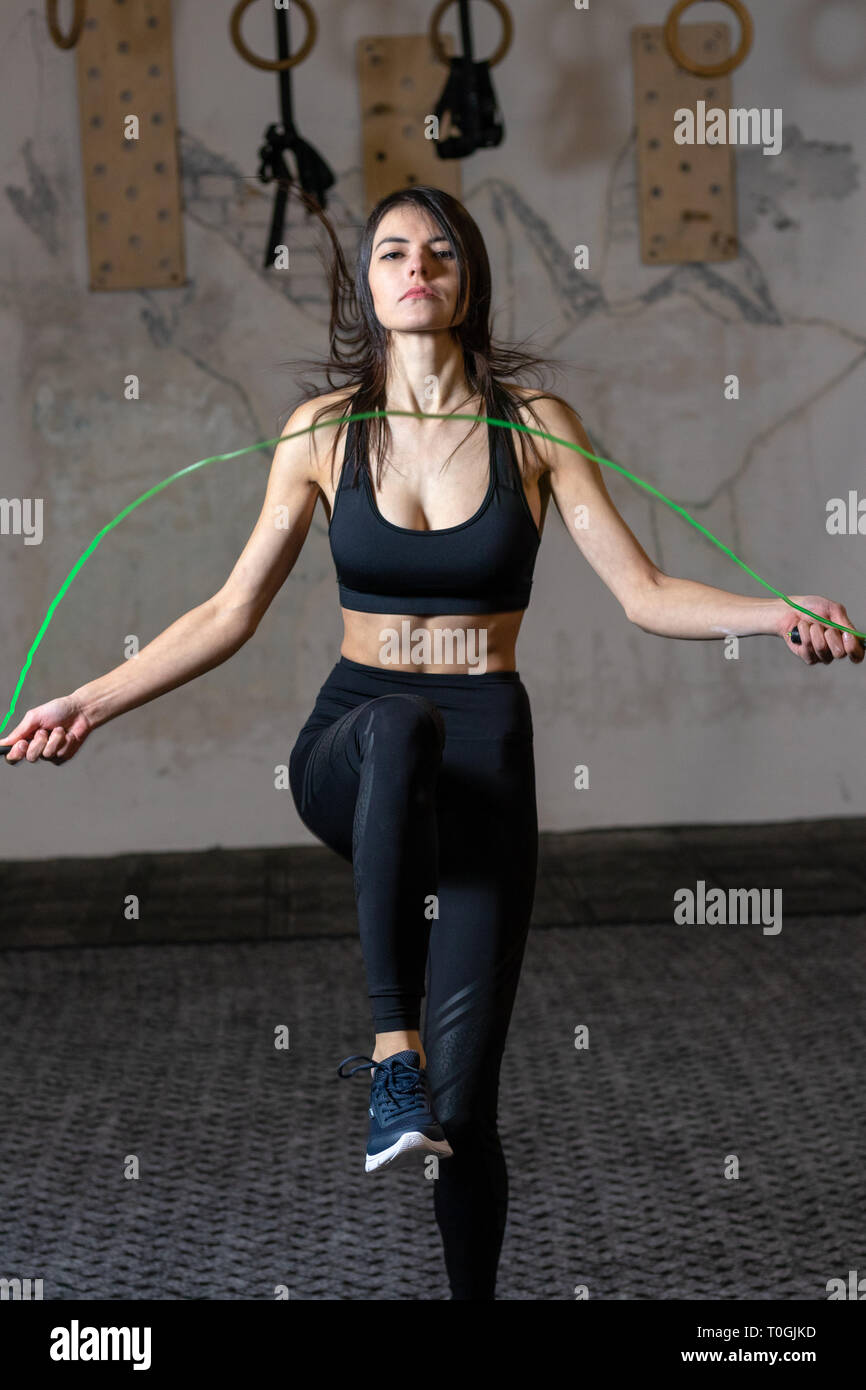 Girl jumping rope in the gym Stock Photo - Alamy