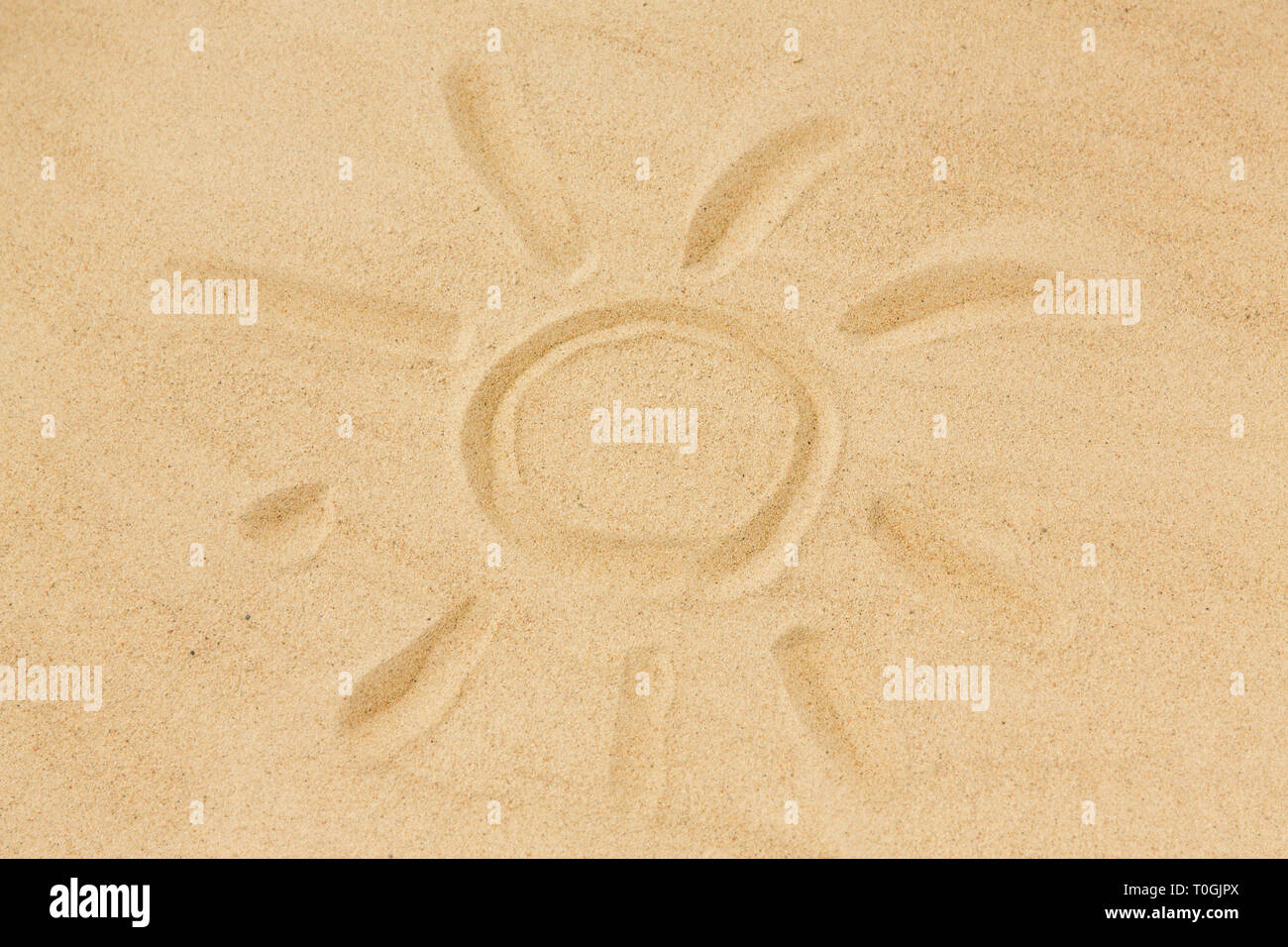 picture of sun in sand on summer beach Stock Photo - Alamy