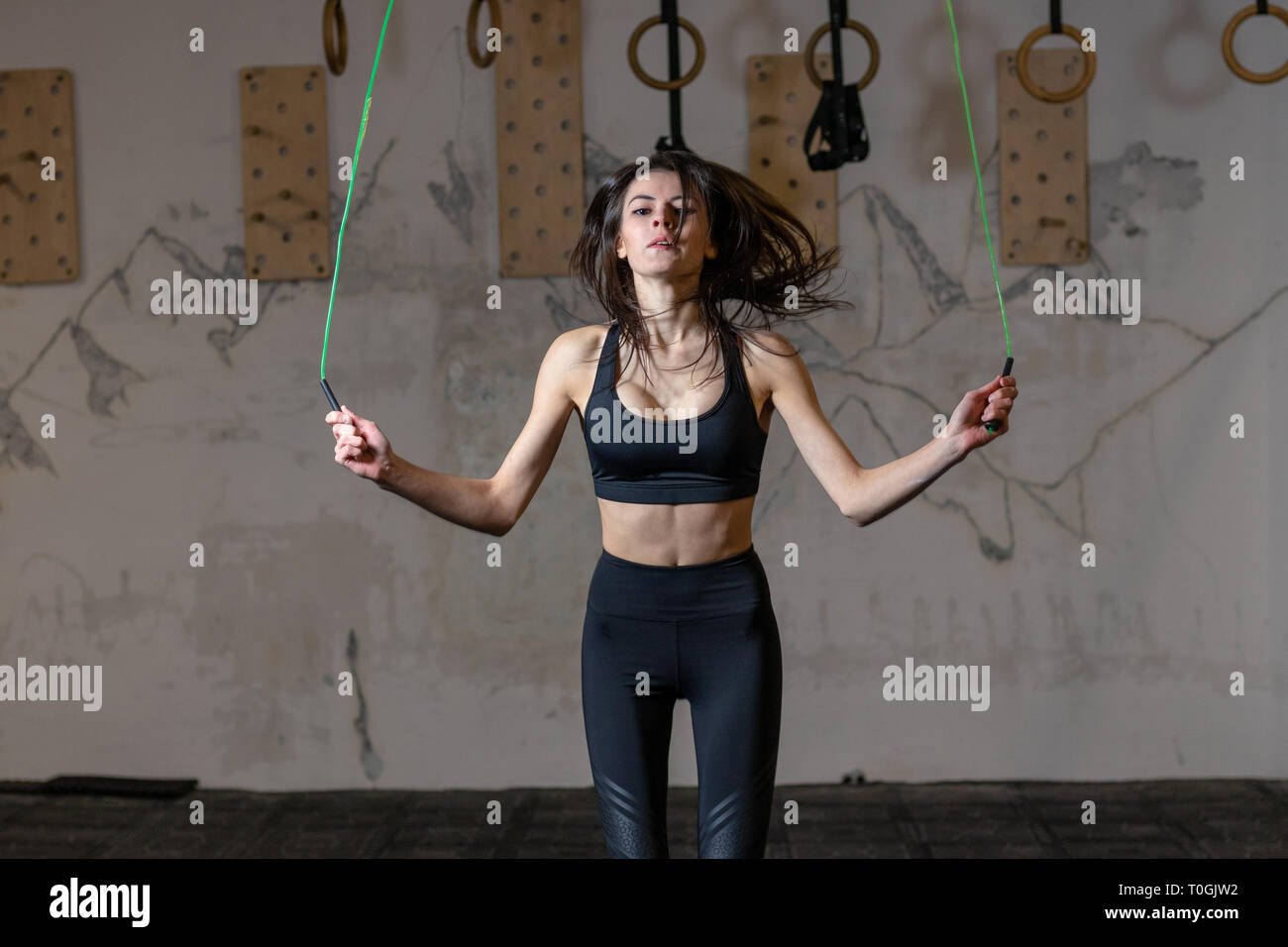 Girl jumping rope in the gym Stock Photo - Alamy