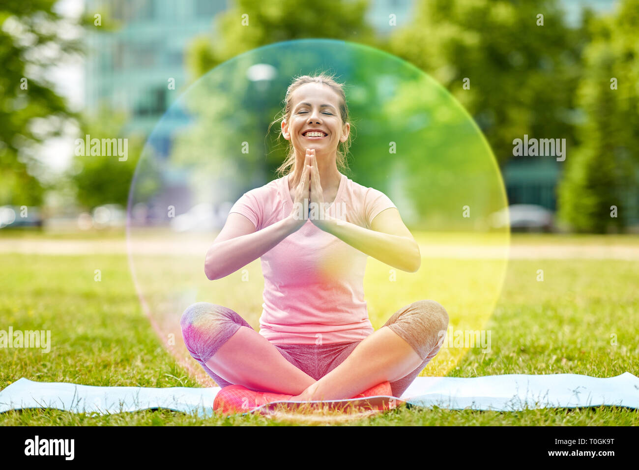happy woman meditating in summer park Stock Photo - Alamy