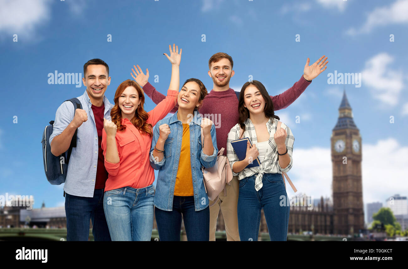 happy students celebrating success over london Stock Photo - Alamy