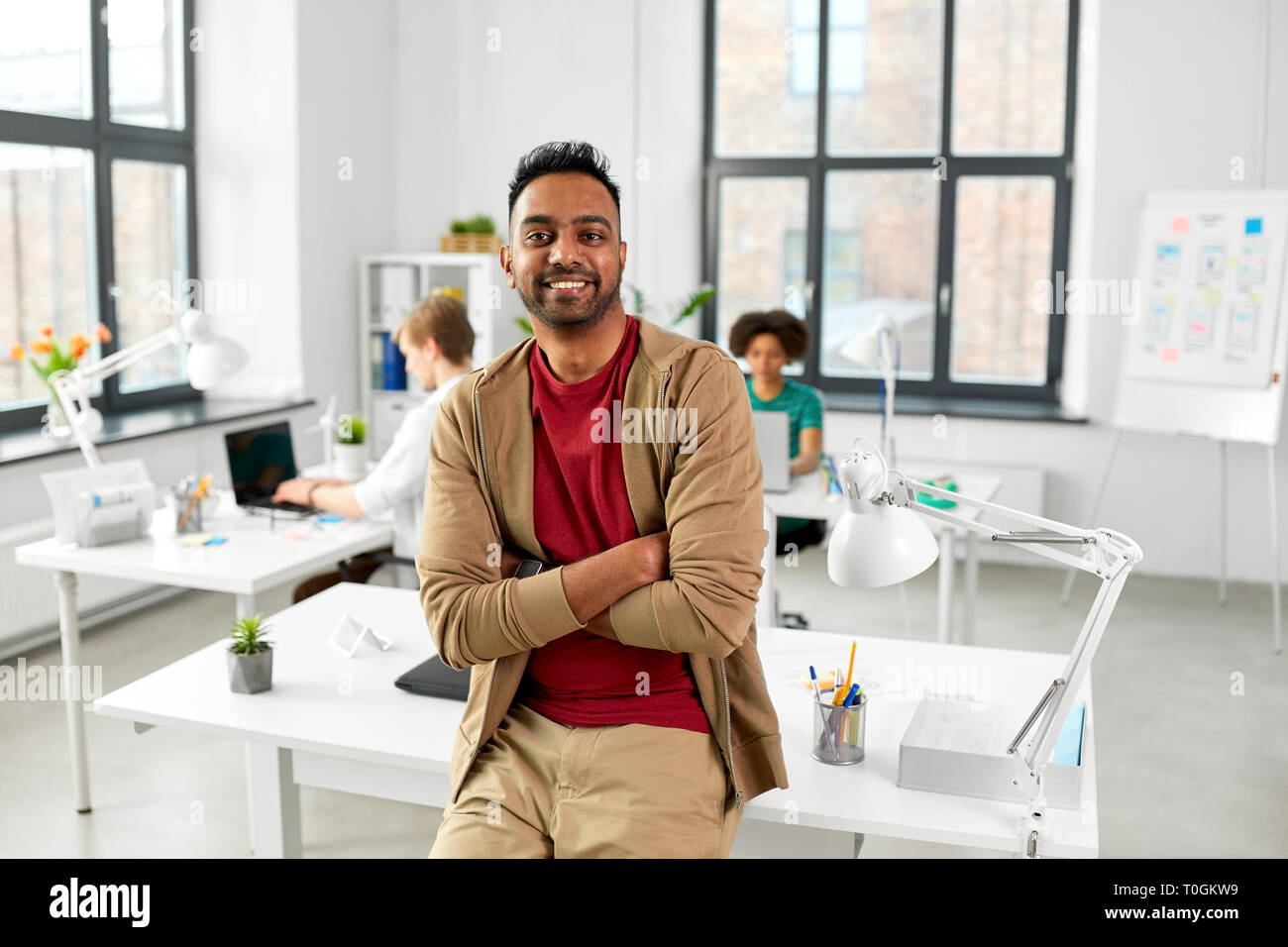 smiling indian man at office Stock Photo - Alamy
