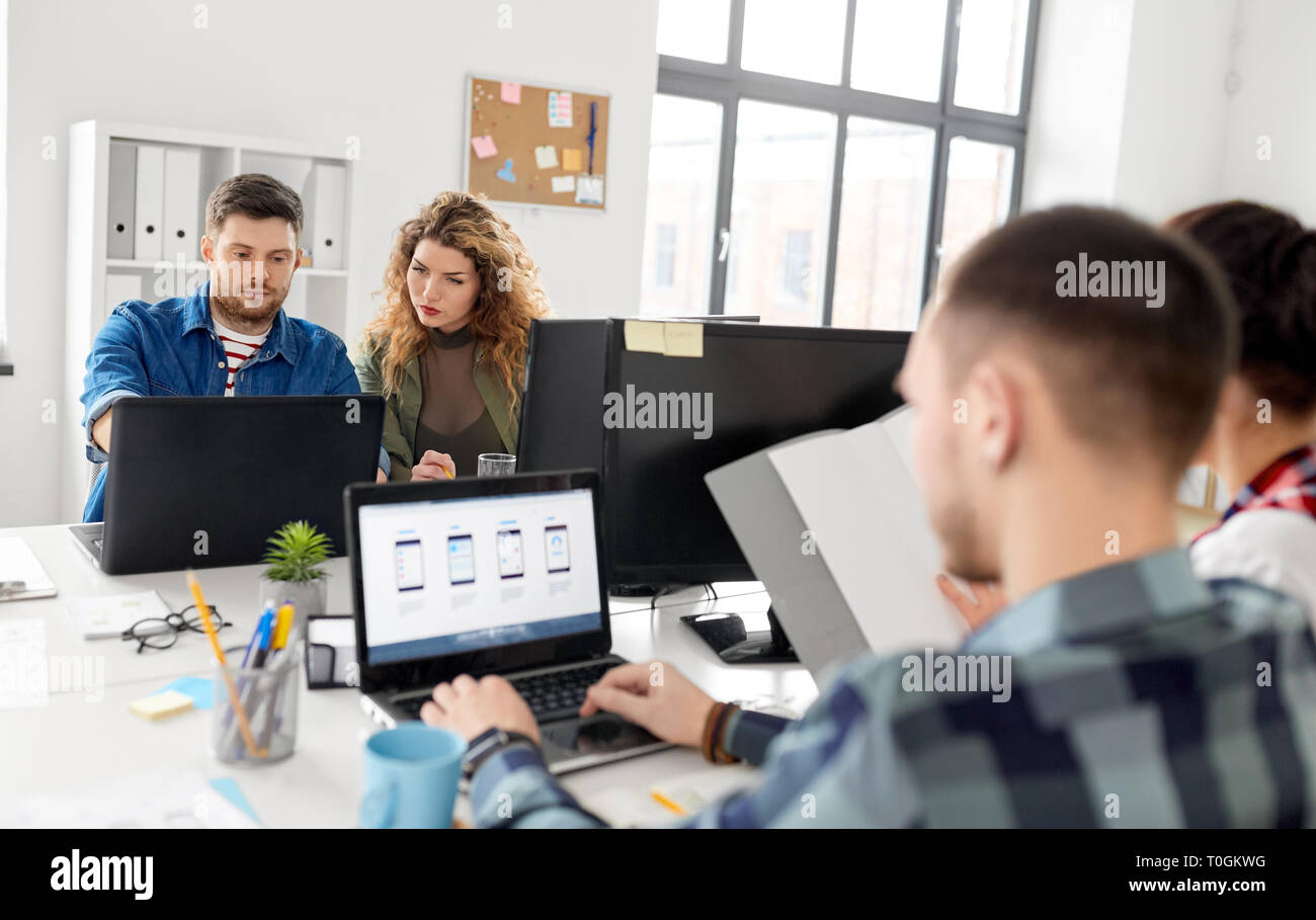 creative team working on user interface at office Stock Photo - Alamy