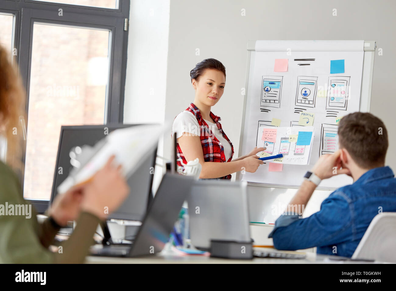 creative woman showing user interface at office Stock Photo - Alamy
