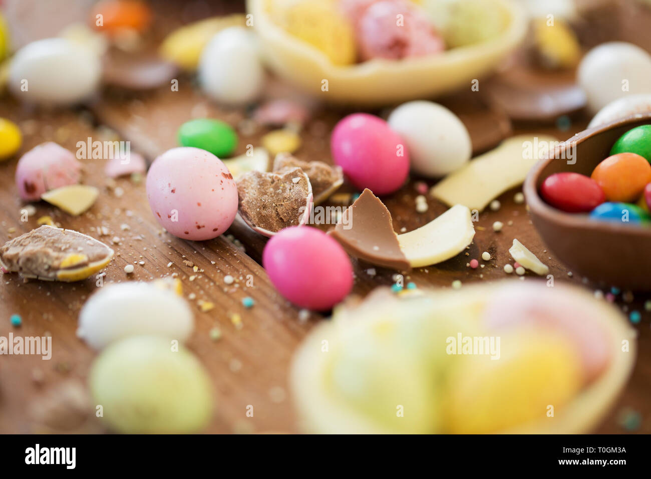 chocolate easter eggs and candy drops on table Stock Photo - Alamy
