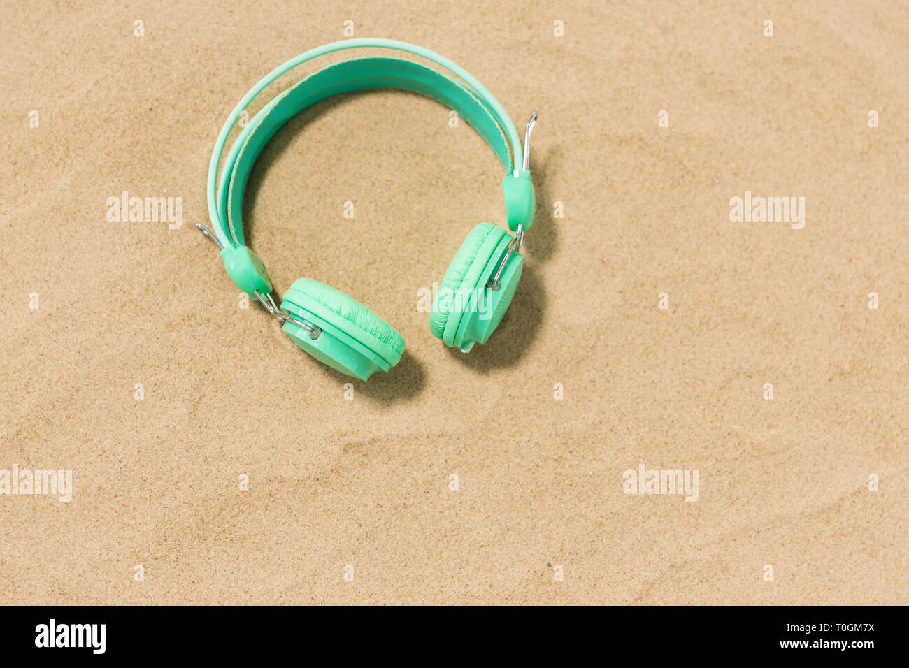 earphones on summer beach sand Stock Photo - Alamy