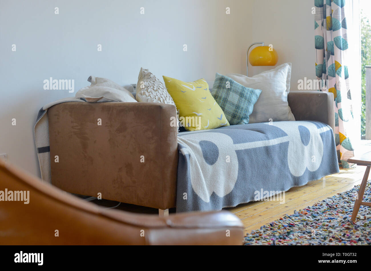 Cool, airy and open feeling living room with bright simple decor Stock ...