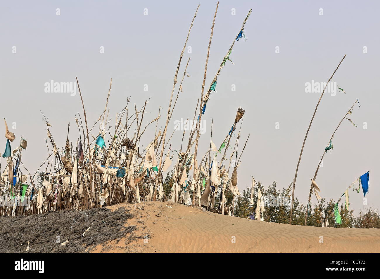 Votive flags-burial mound-Imam Asim's mazar or mausoleum area ...