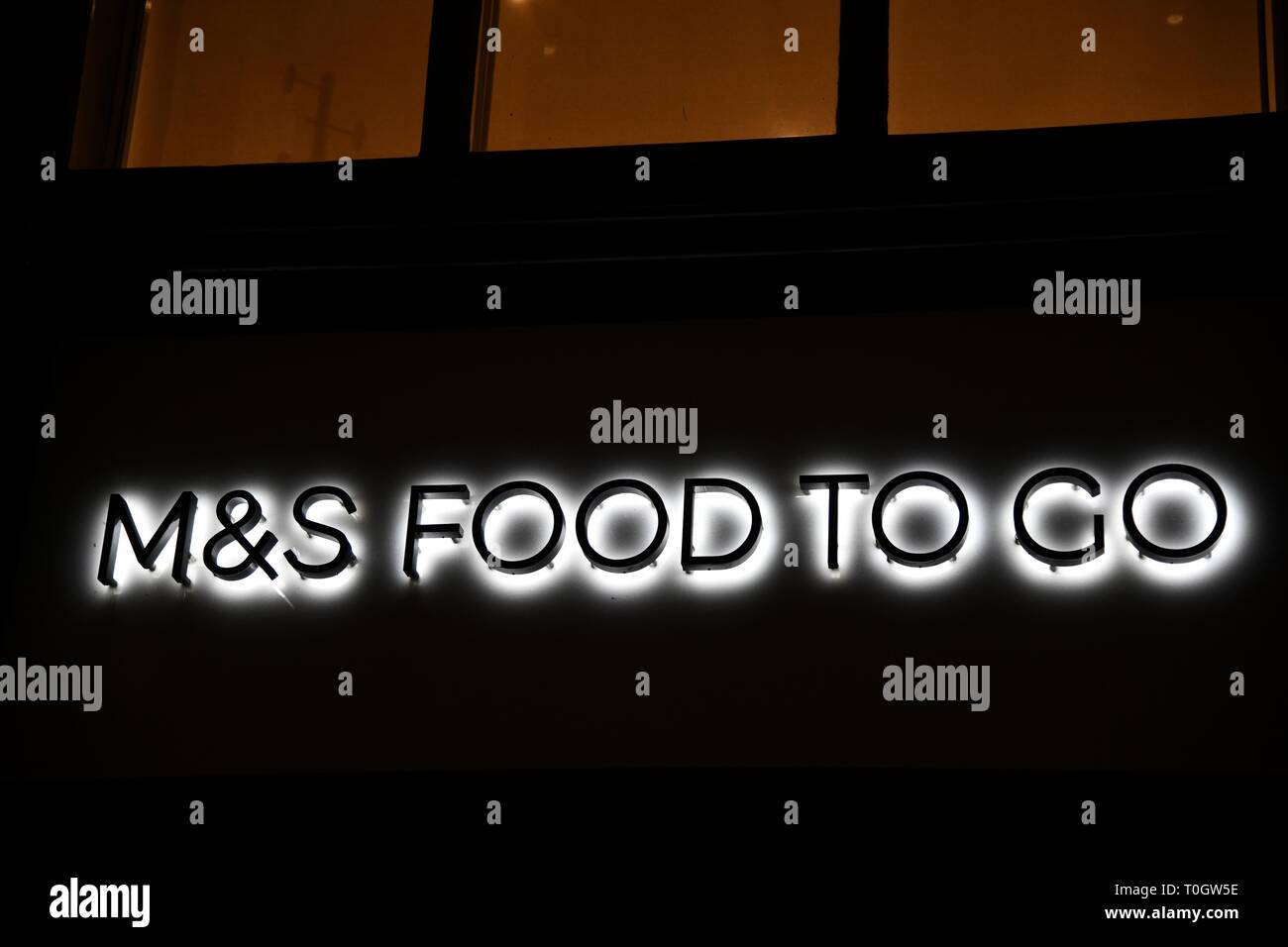 Illuminated shop signs Stock Photo - Alamy