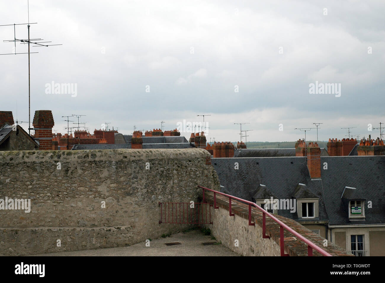 view from panoramic terrace in Blois, France, over slat roofs with ...