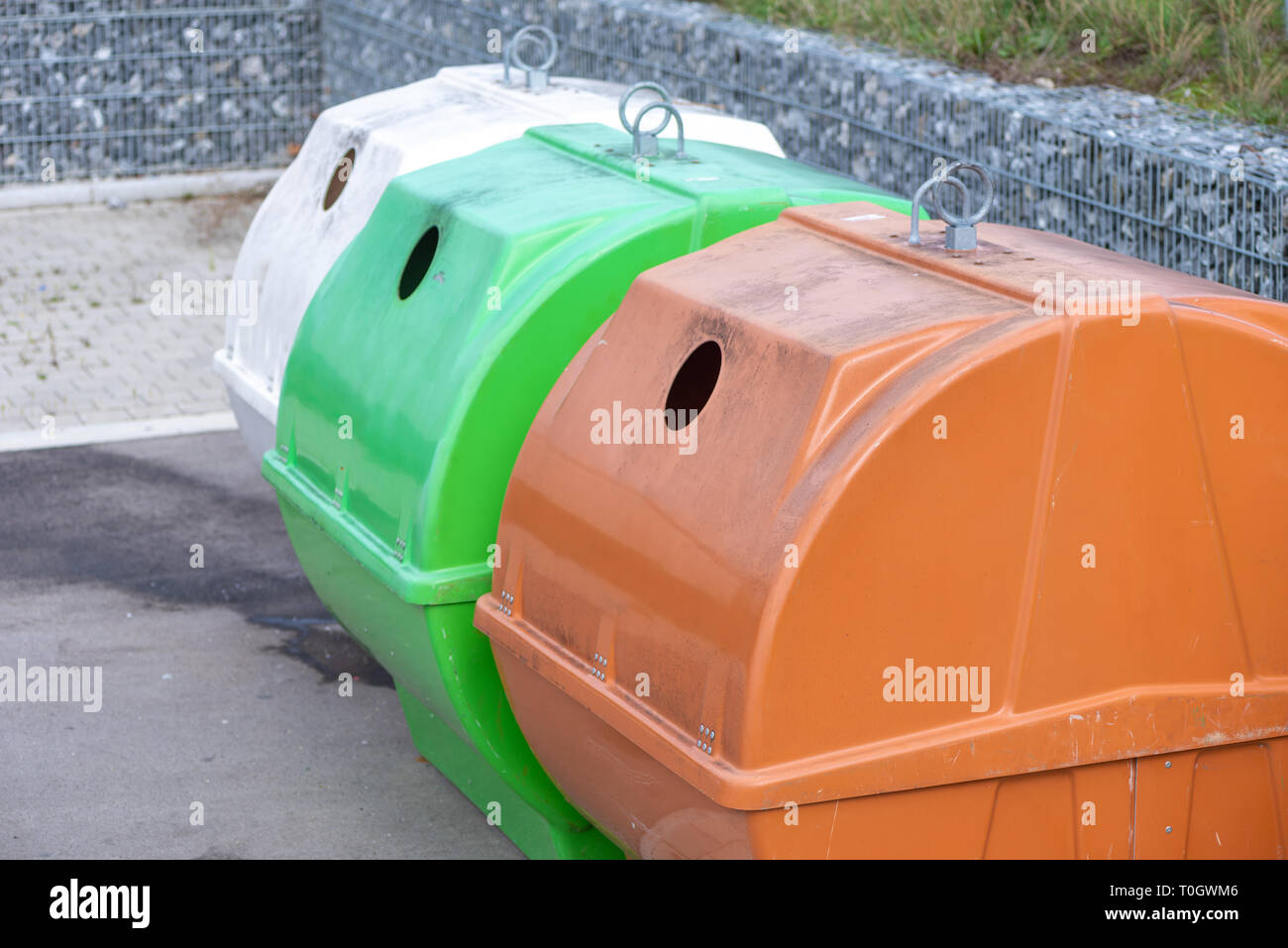 Three big Containers in different colors to collect recyclable waste ...