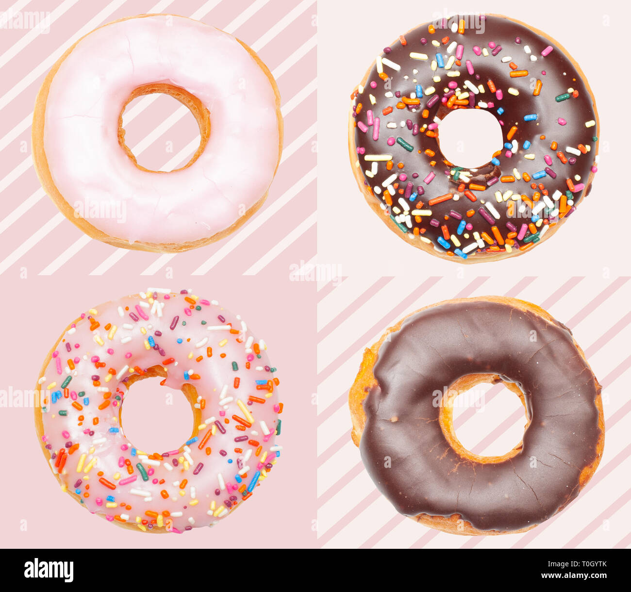 Colorful donuts with icing on pastel pink background Stock Photo - Alamy
