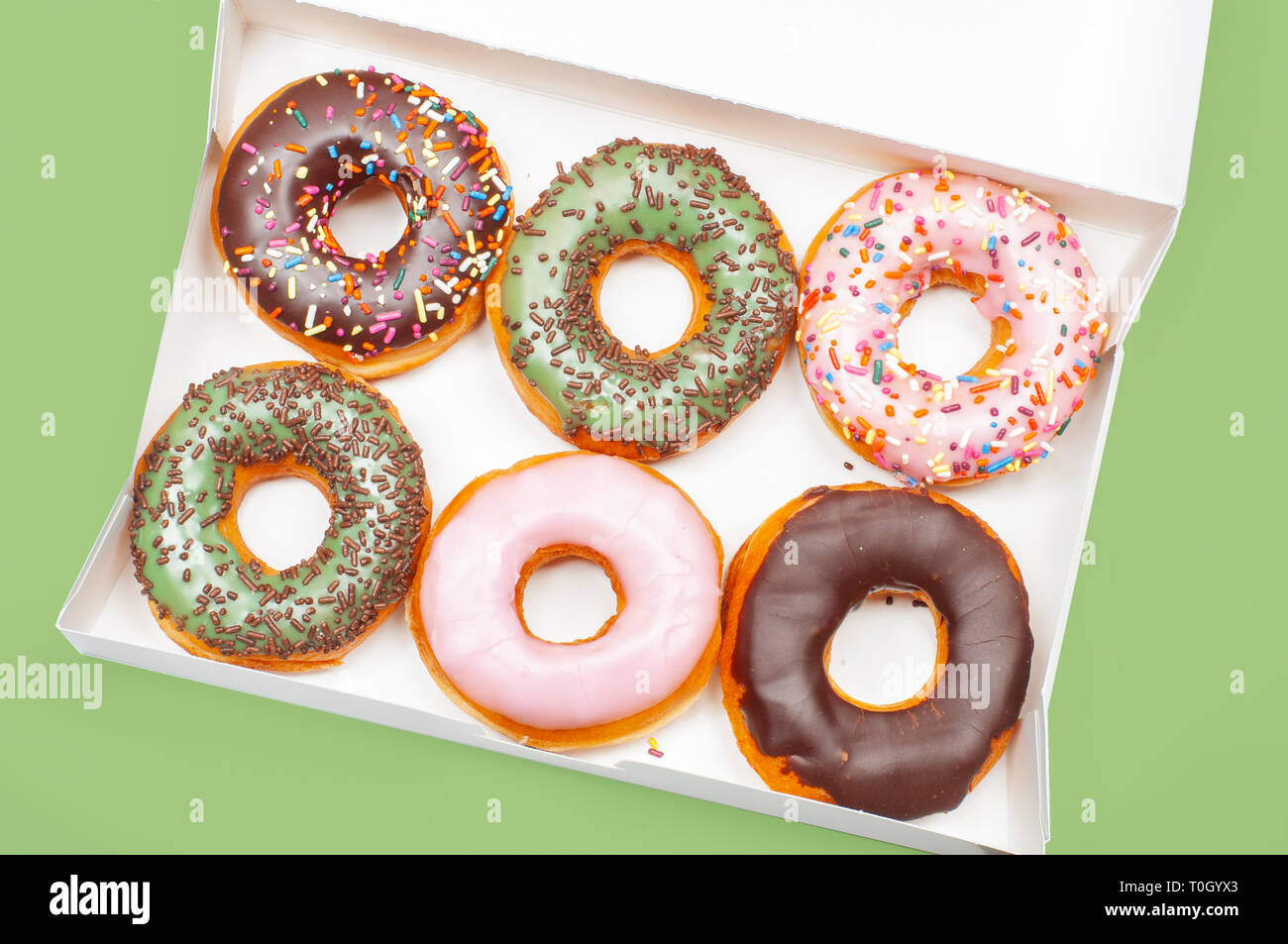 Assorted donuts on pastel hi-res stock photography and images - Alamy