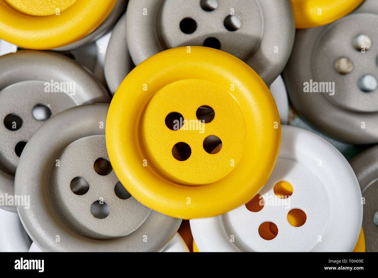 Large white, grey and yellow buttons Stock Photo - Alamy