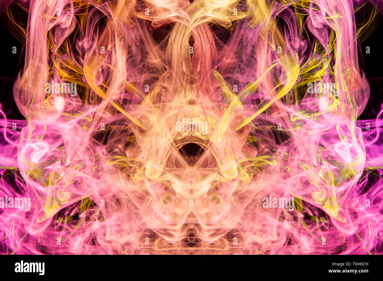 Cloud of yellow and pink smoke in the form of a skull, monster, dragon ...