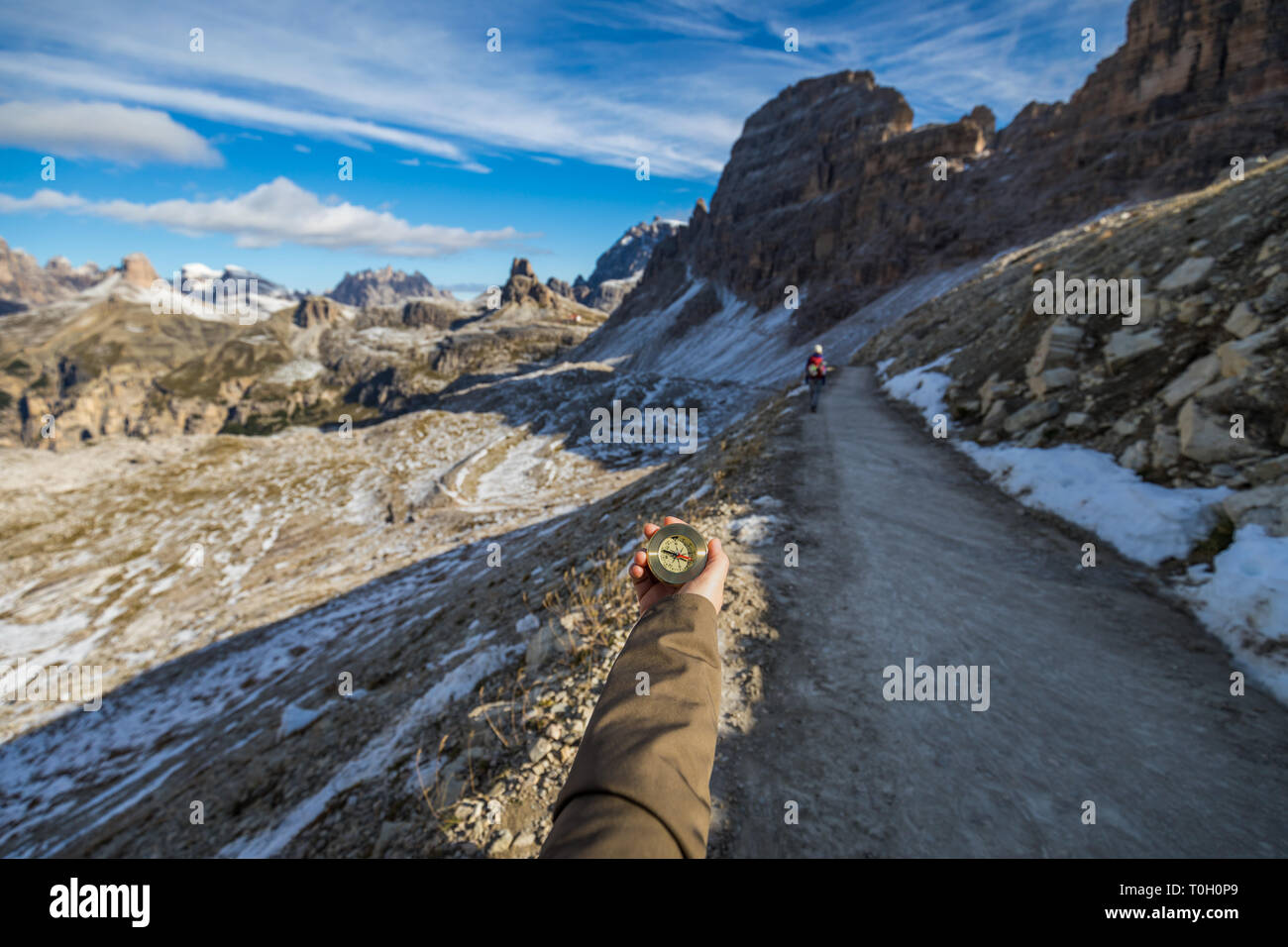 Explorer searching direction with compass in summer mountains, point of ...