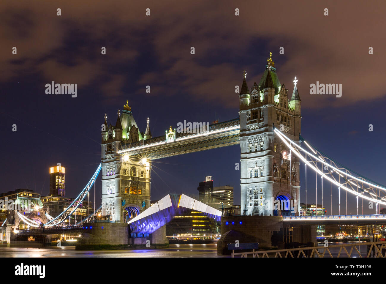 Tower Bridge raised to let ship pass through. London, England Stock ...