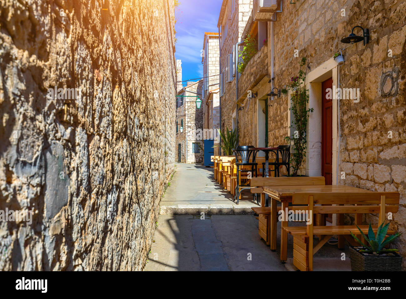 Beautiful street with flowers in the Hvar town, Hvar island, Dalmatia ...