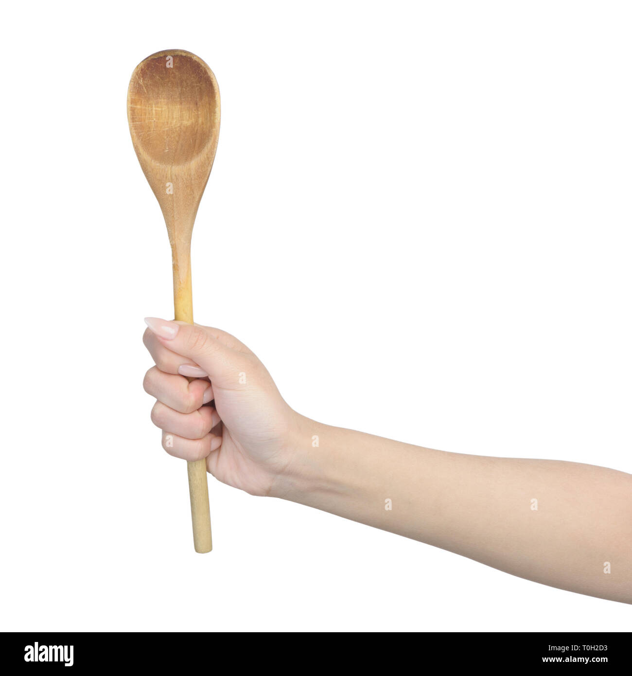 Wooden spoon in female hand isolated on white Stock Photo - Alamy