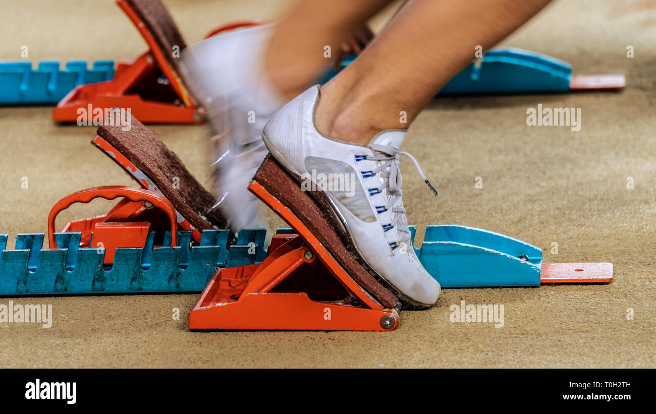 Sprinter getting ready to start the race Stock Photo - Alamy