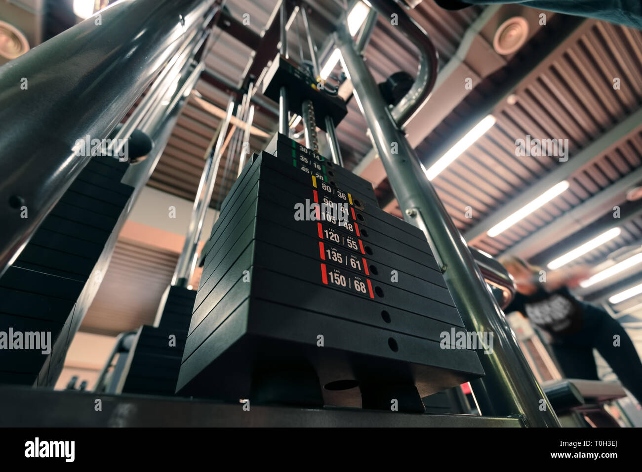 Weights in gym machine Stock Photo - Alamy