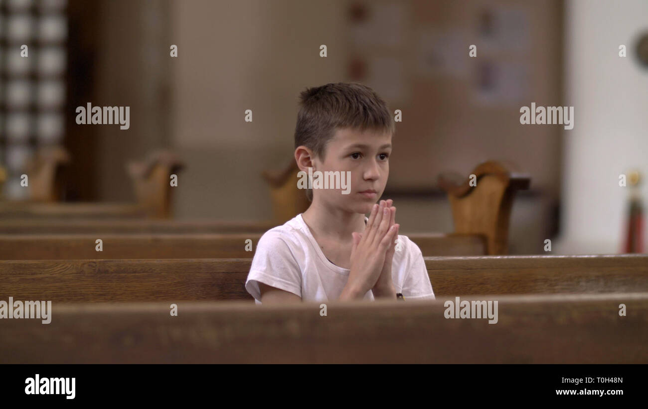 Child catholic pray church hi-res stock photography and images - Alamy