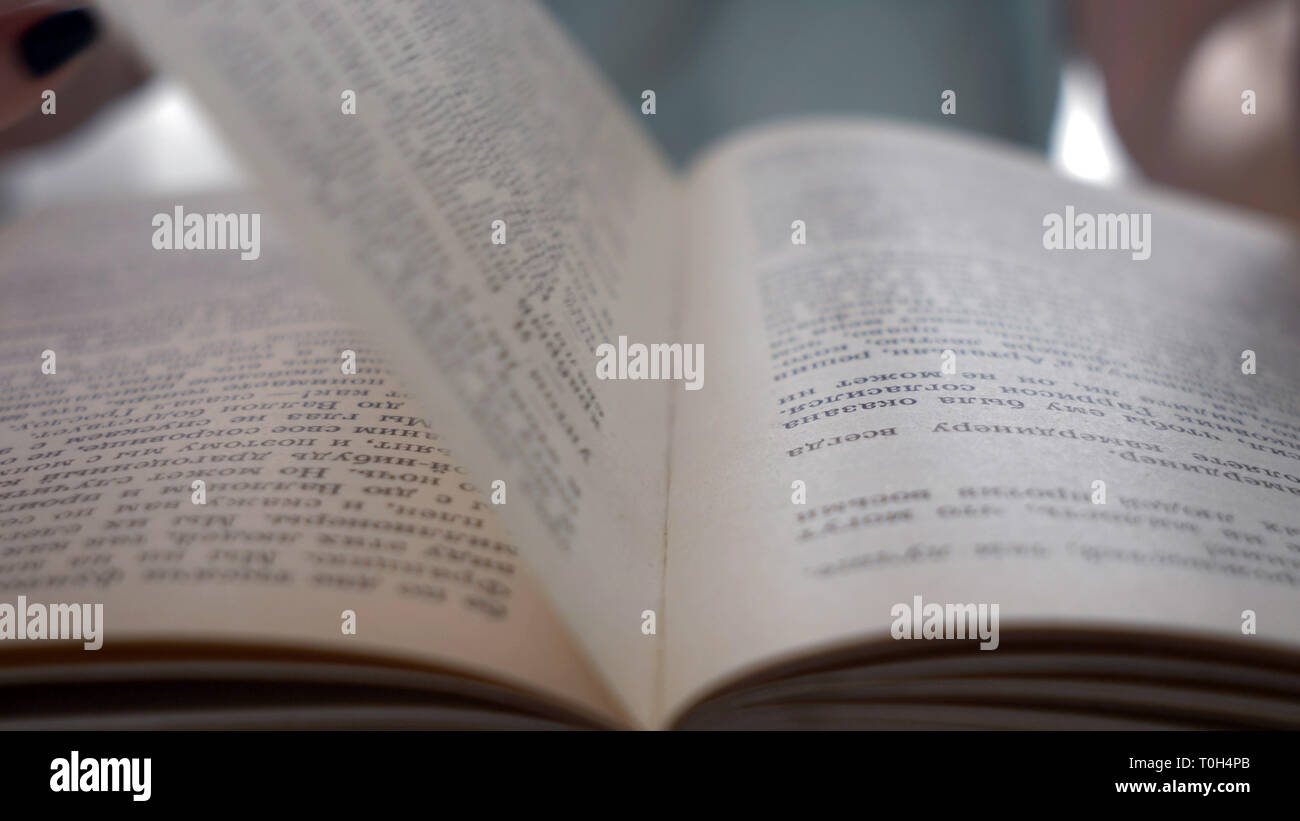 Flips through book hi-res stock photography and images - Alamy