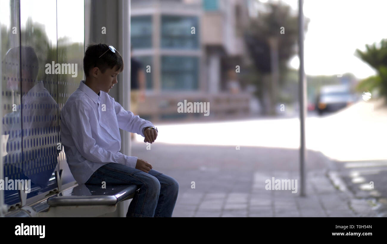 Boy bus stop sad hi-res stock photography and images - Alamy