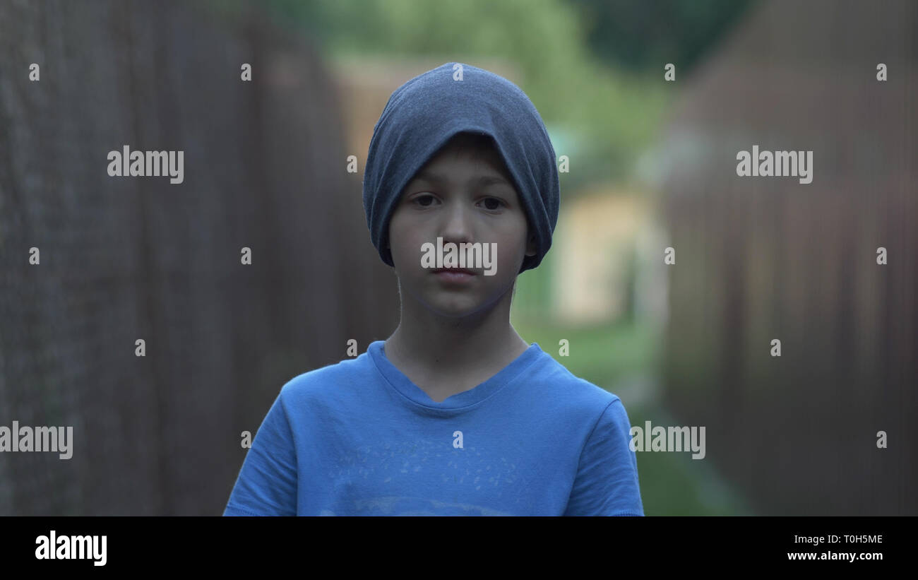 lonely homeless teenage boy standing and looking at the camera Stock ...