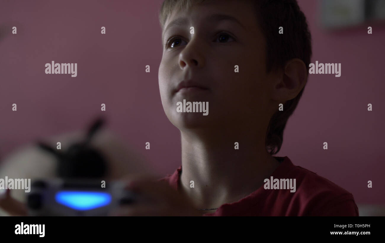 Boy with controller hi-res stock photography and images - Alamy