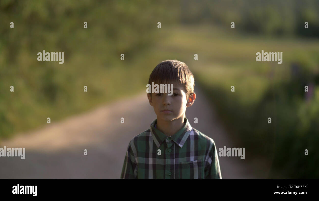 Teen boy walking away hi-res stock photography and images - Alamy