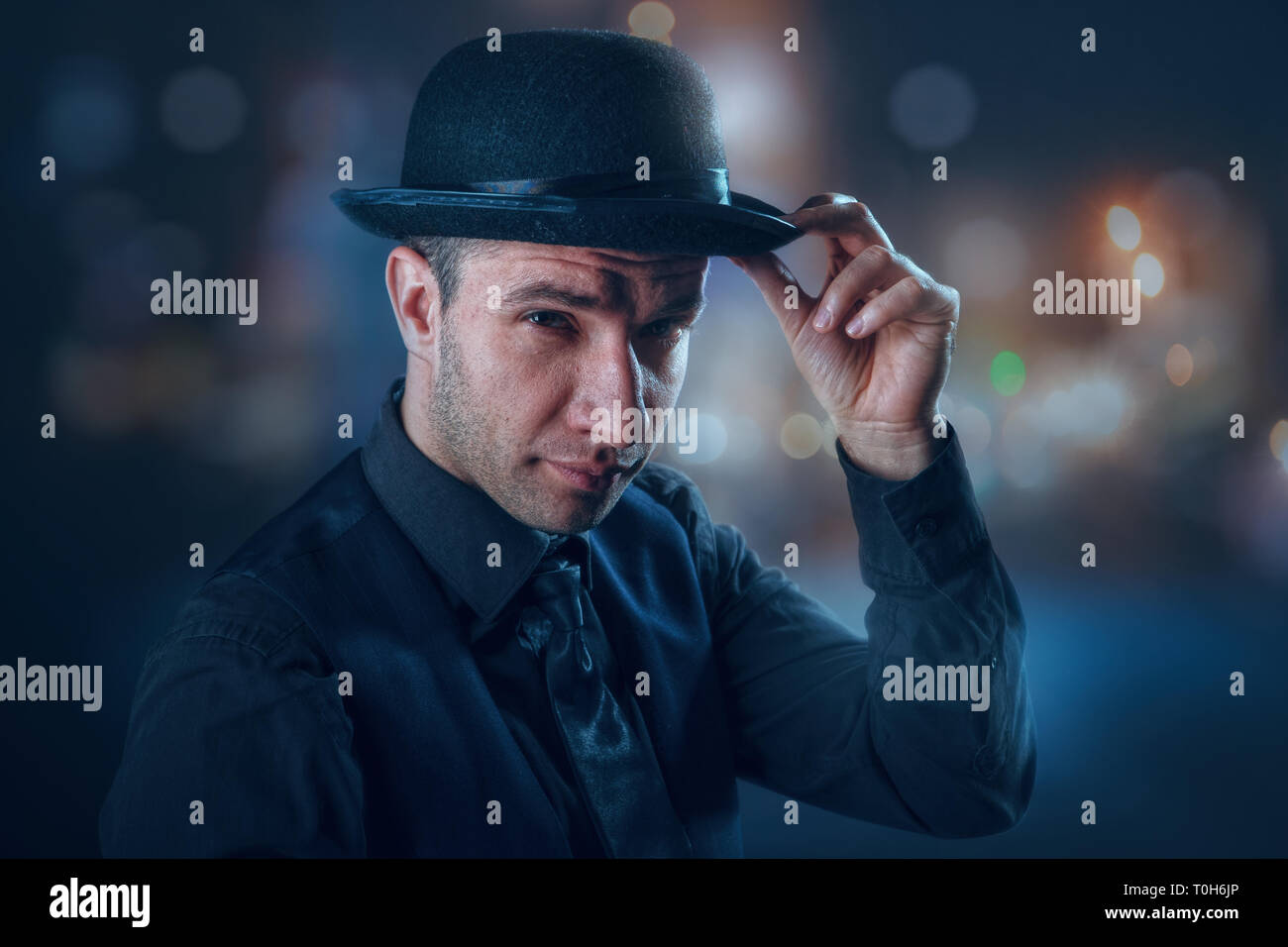 Sharp dressed man. Urban male portrait with outdoor lights as ...