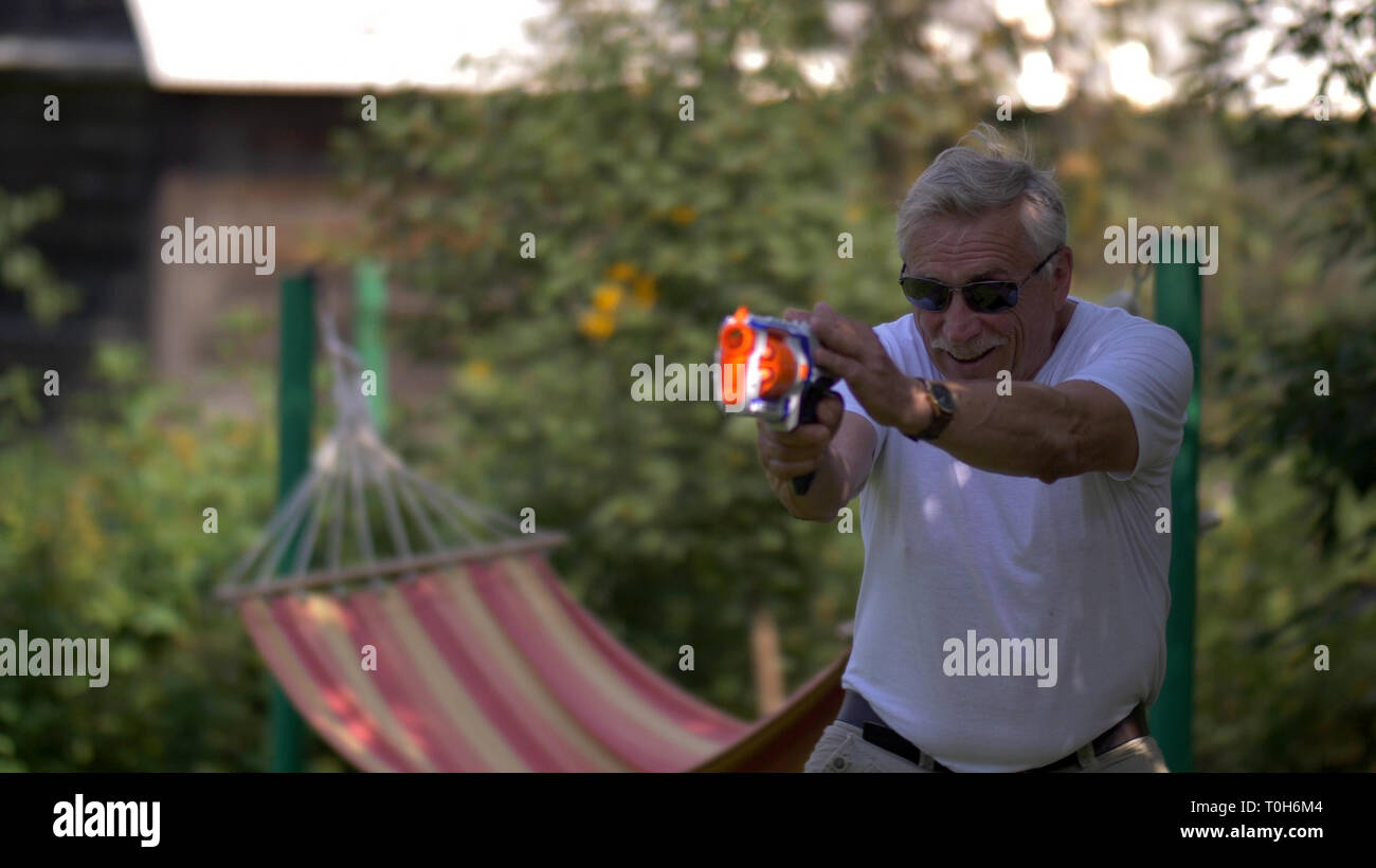 Toy gun man hi-res stock photography and images - Alamy