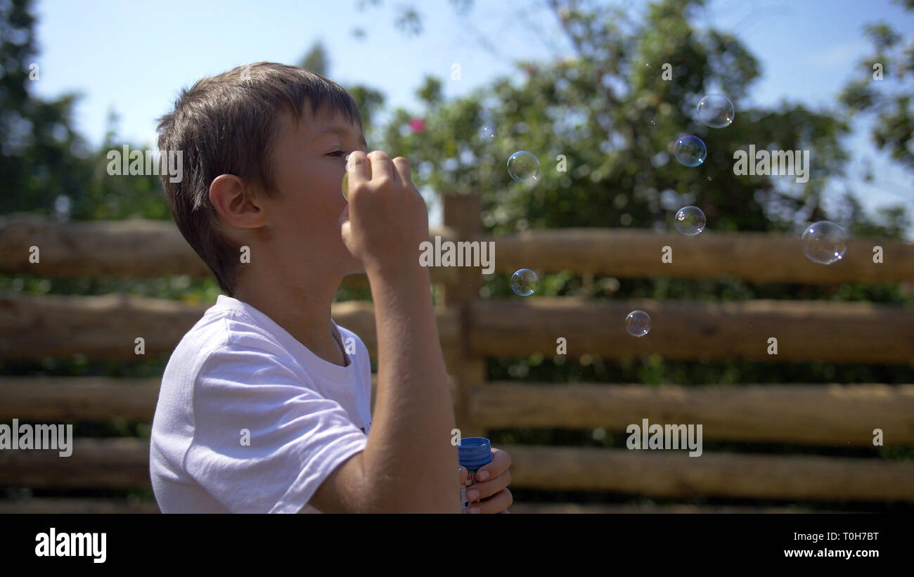 Boy girl blowing bubbles hi-res stock photography and images - Alamy