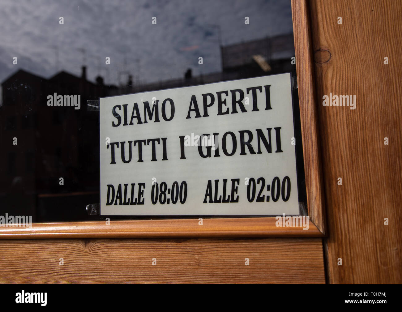 Open sign in a shop written in italian language, Veneto, Venice, Italia ...