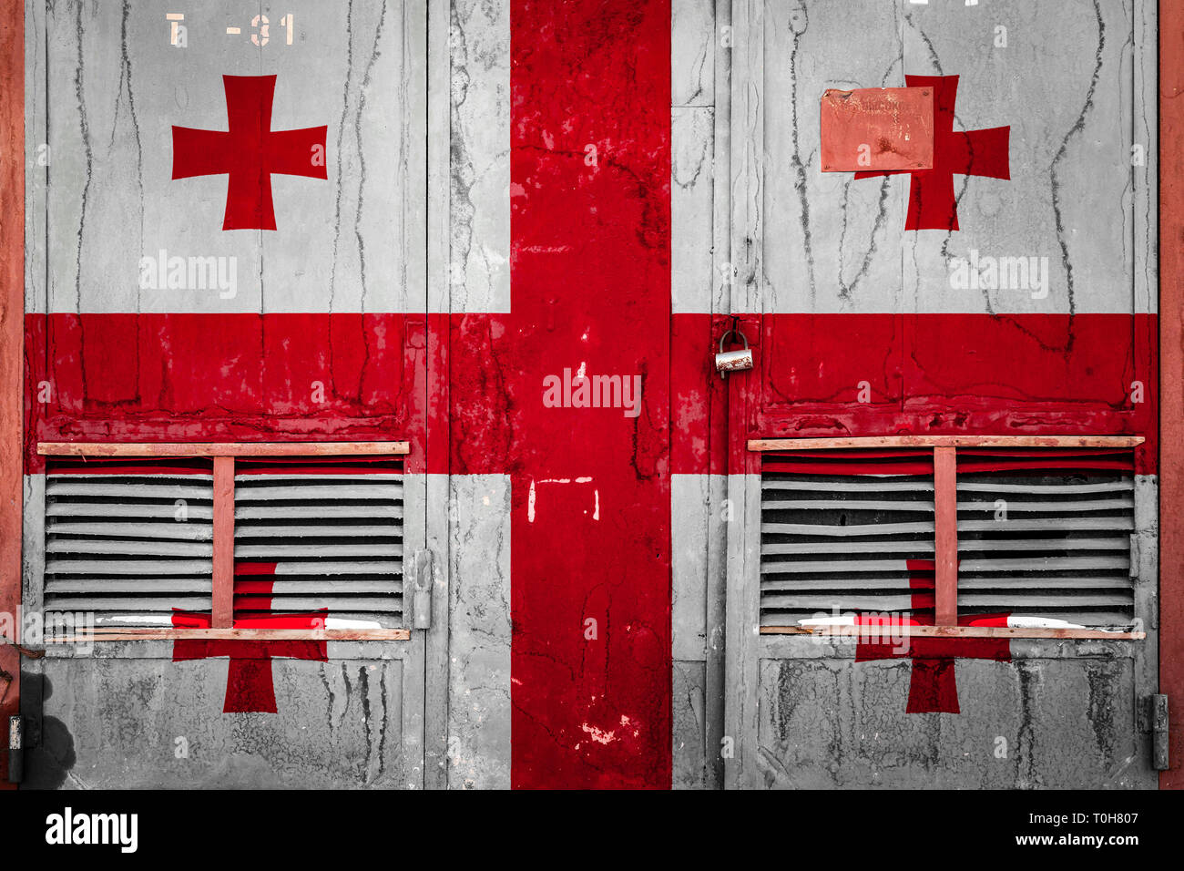 Close-up of old warehouse gate with national flag of Georgia. Concept ...