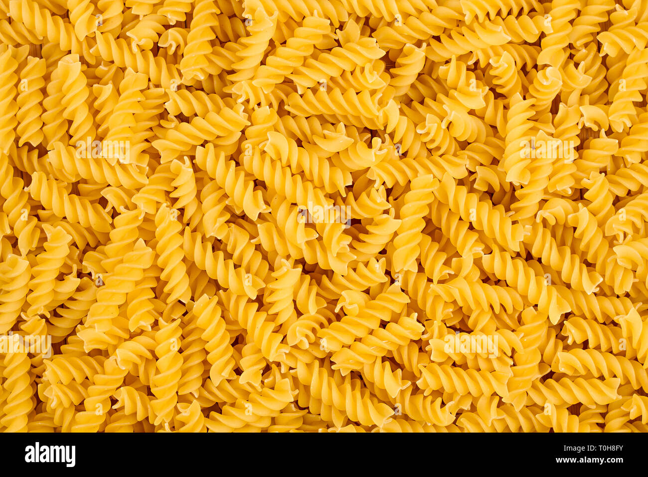 texture of raw spirelli noodles pasta italian food macro close-up ...