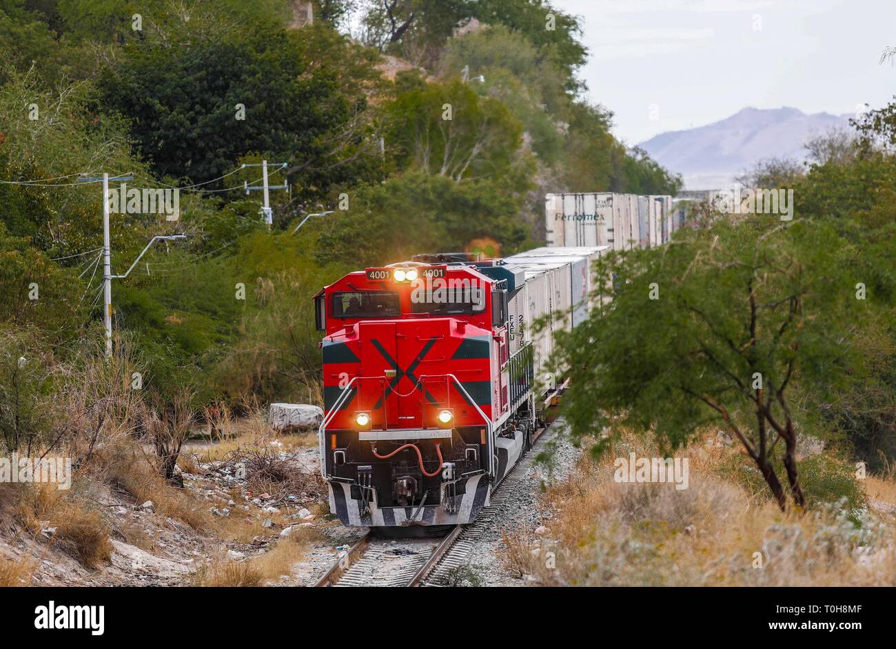 Train or Mexican railways passing through the popular colony in ...