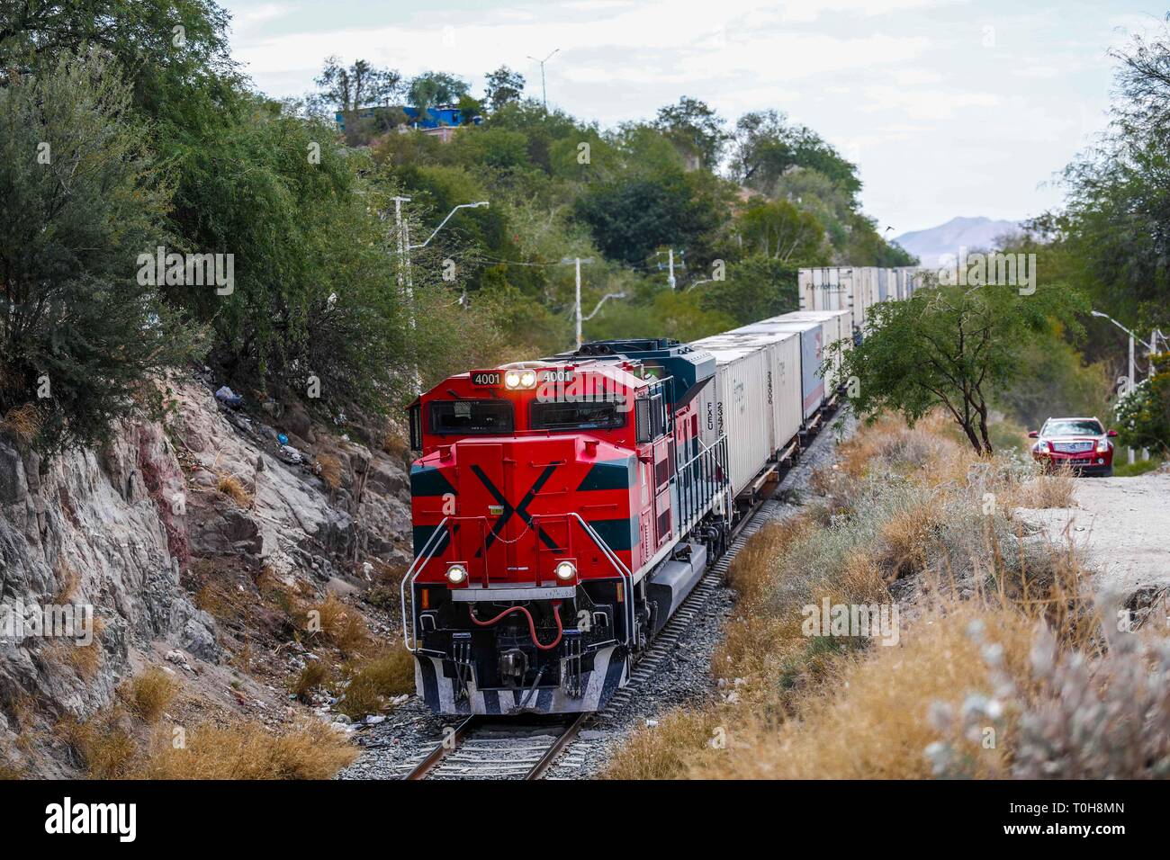 Train or Mexican railways passing through the popular colony in ...