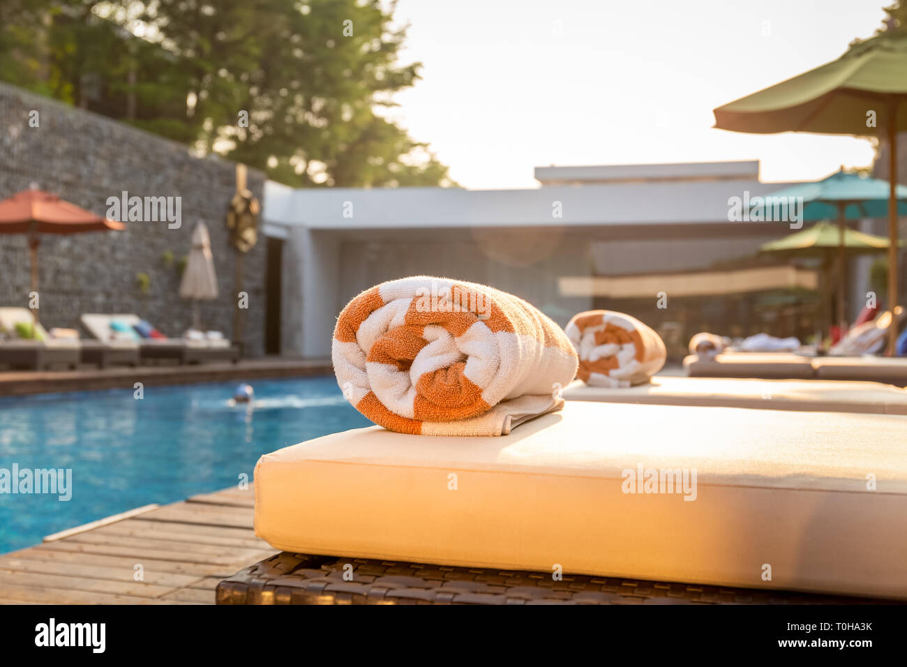 Selective focus at towel pool on beach bed around swimming pool in ...