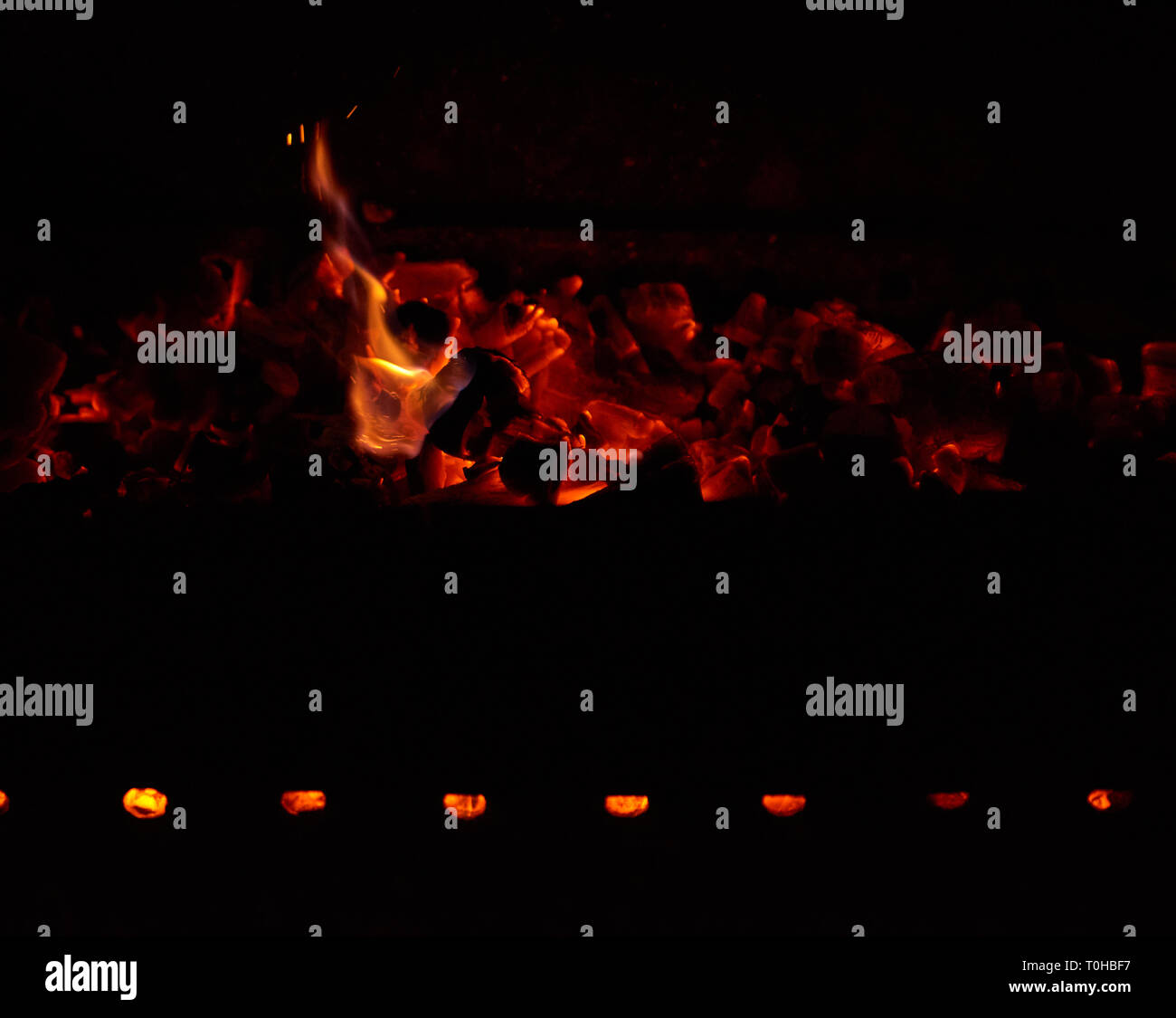 burning wooden logs in the fire at night, black background Stock Photo ...