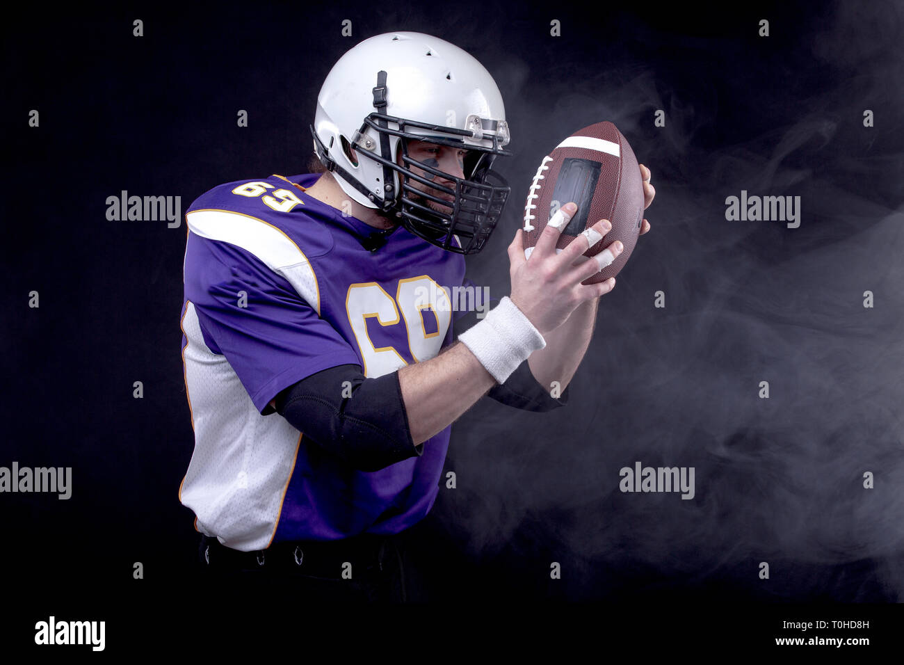 American Footballer in action Stock Photo - Alamy