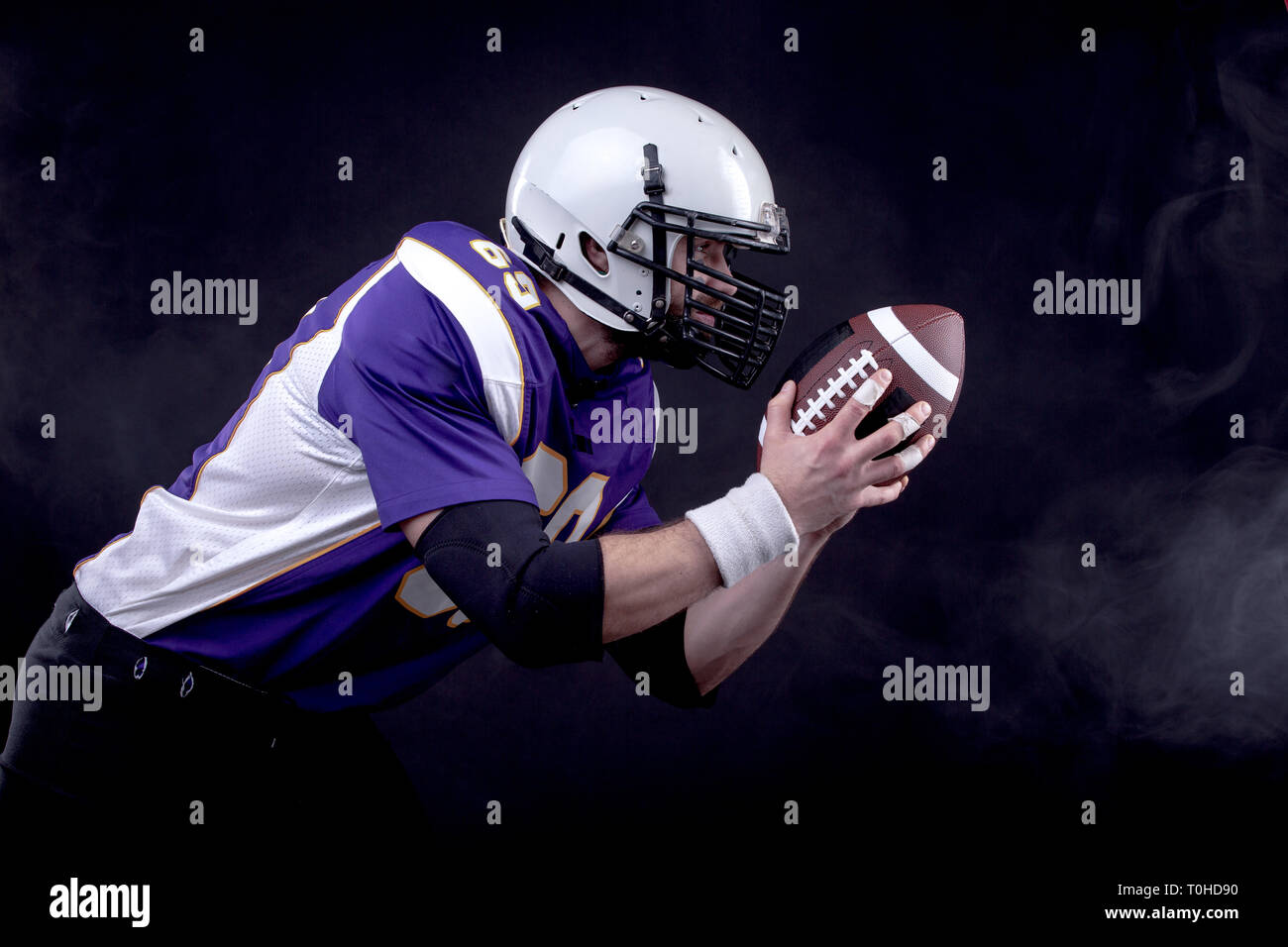 American Footballer in action Stock Photo - Alamy
