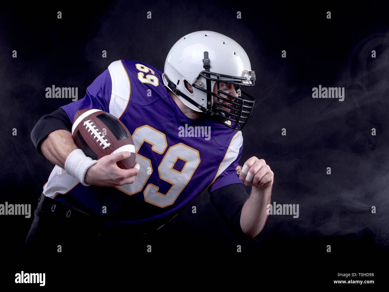 American Footballer in action Stock Photo - Alamy