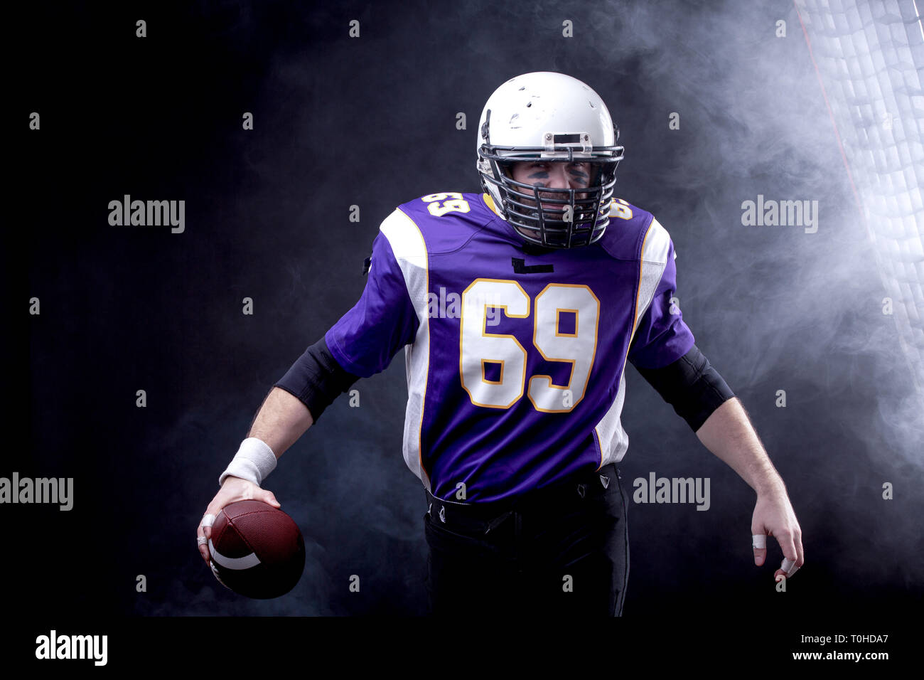 American Footballer in action Stock Photo - Alamy