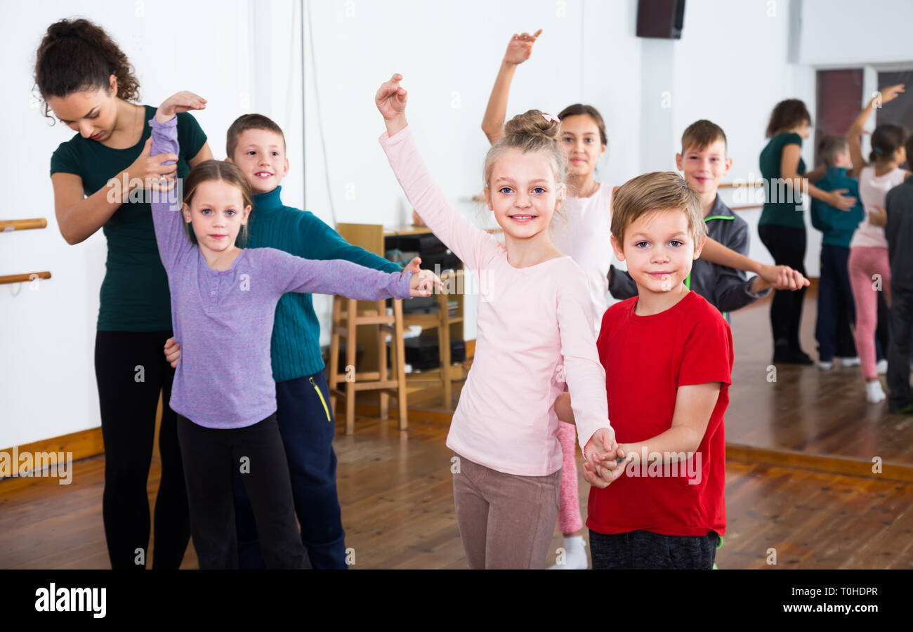 active little boys and girls dancing pair dance in the ballet studio ...