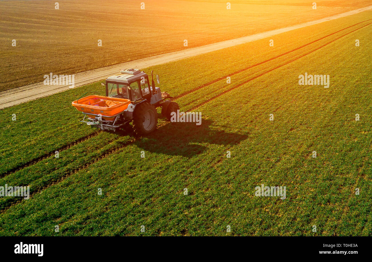 tractor on a green field. aerial survey of agriculture Stock Photo - Alamy